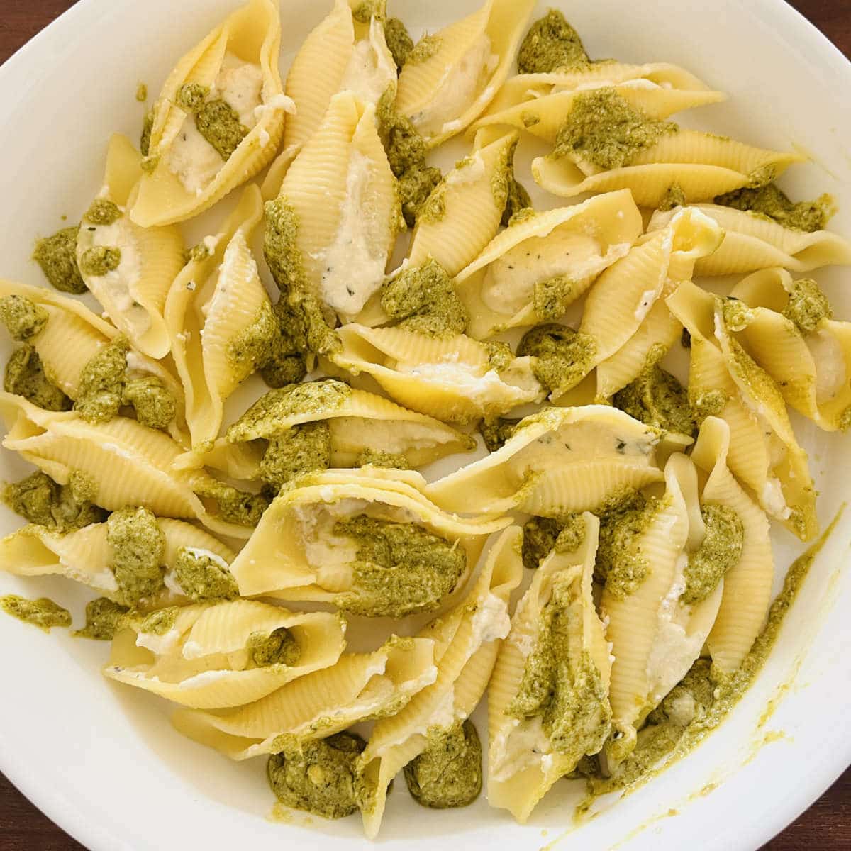 Ricotta stuffed shell pasta in pesto sauce