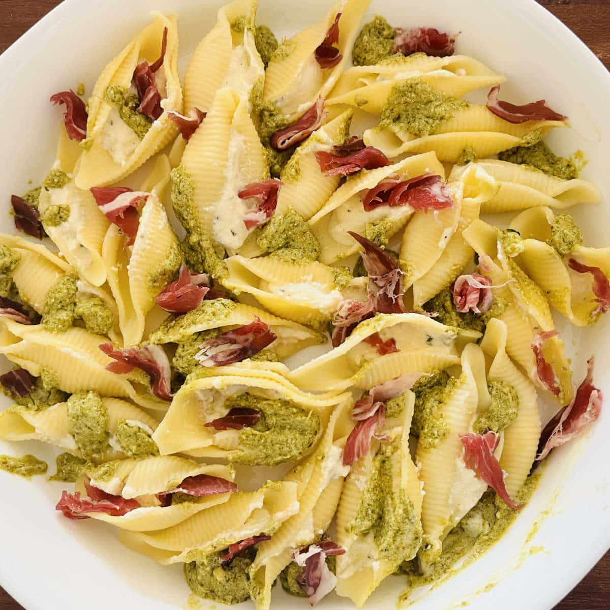 Ricotta stuffed shell pasta in pesto sauce