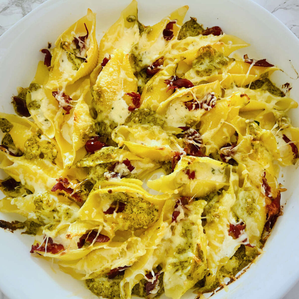 Ricotta stuffed shell pasta in pesto sauce
